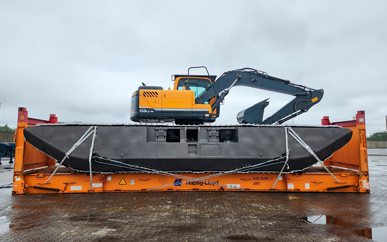 Contêiner flat rack: retroescavadeira é transportada à Guatemala
